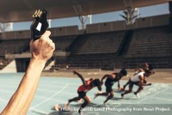 Close Up Of Hand Firing A Starter Pistol To Start The Running Race ...
