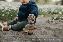 Toddler Stacking Rocks Outside - Free Photo (48LxJ4) - Noun Project