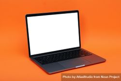 Laptop at angle with mockup screen in orange studio shoot - Premium ...