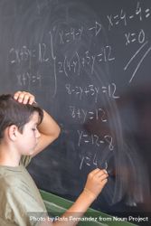 Teenager solving equation at chalk board - Free Photo (0yRYW5) - Noun ...