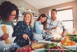 Happy Friends Smiling While Cooking In A Bright Kitchen. - Free Photo ...