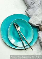 Top view of bright teal plates with silverware - Premium Photo (56GvZe ...