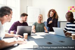 Group of people working around an table - Premium Photo (4BMVE5) - Noun ...