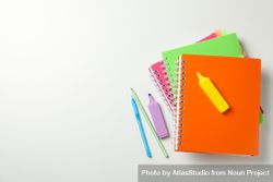 Top View Of Multi-Colored Notebooks And Highlighters With Space For ...