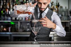 Bartender straining a cocktailing into a glass - Free Photo (489NKb ...