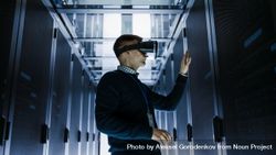 IT Engineer Wearing Virtual Reality Headset Works with Augmented ...