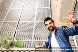 Man Smiling Leaning Off Rail Outside - Free Photo (beVZN0) - Noun Project