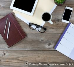 Desktop with a mixture of simple technology and traditional objects ...